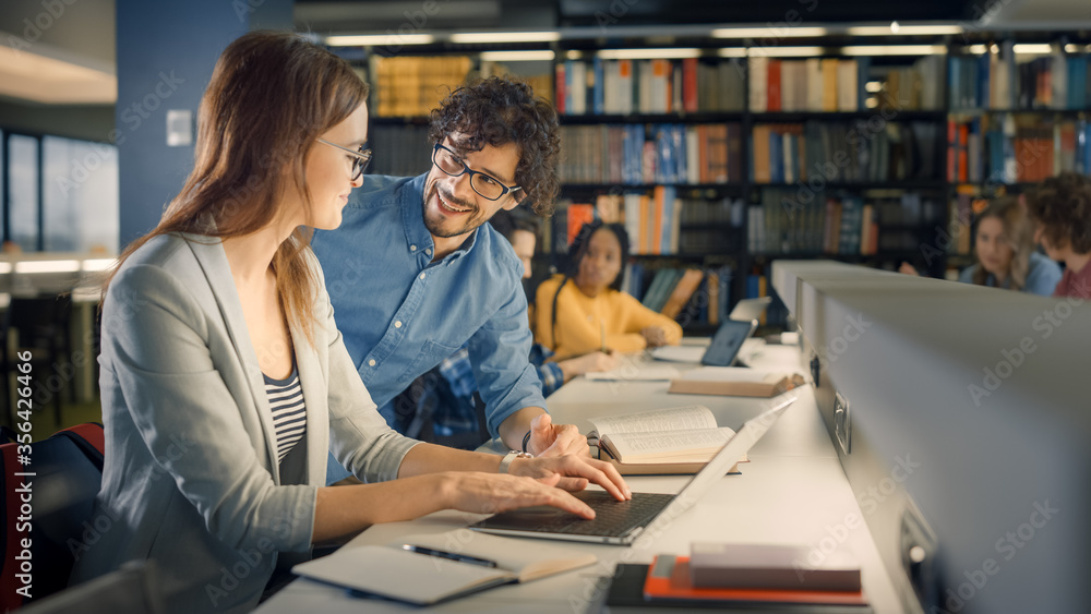 University Library: Talented Caucasian Girl uses Laptop, Smart Helpful ...