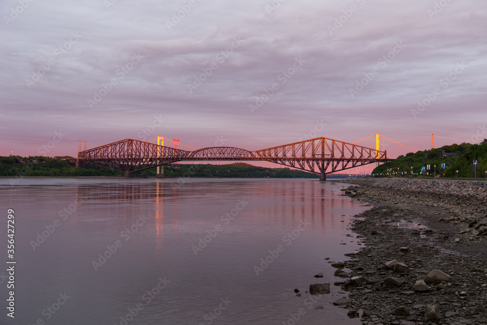 West view of the 1919 steel truss Quebec Bridge and the 1970 suspension ...