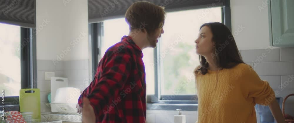 Couple having a big fight, pushing and yelling at each other and in the ...