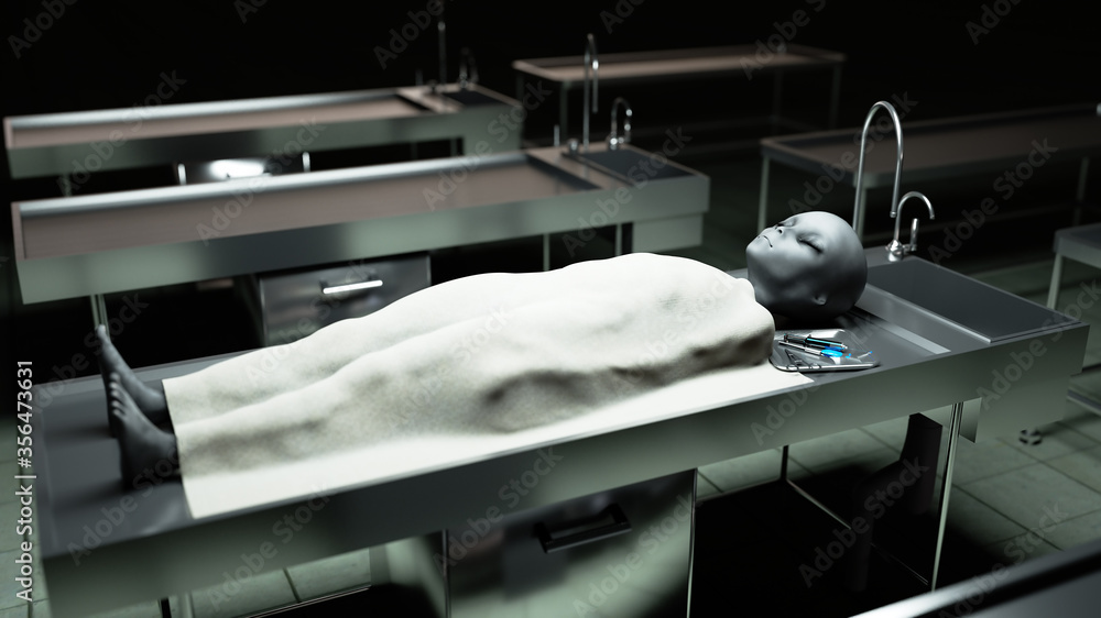 The dead alien in the morgue on the table. Futuristic autopsy concept ...