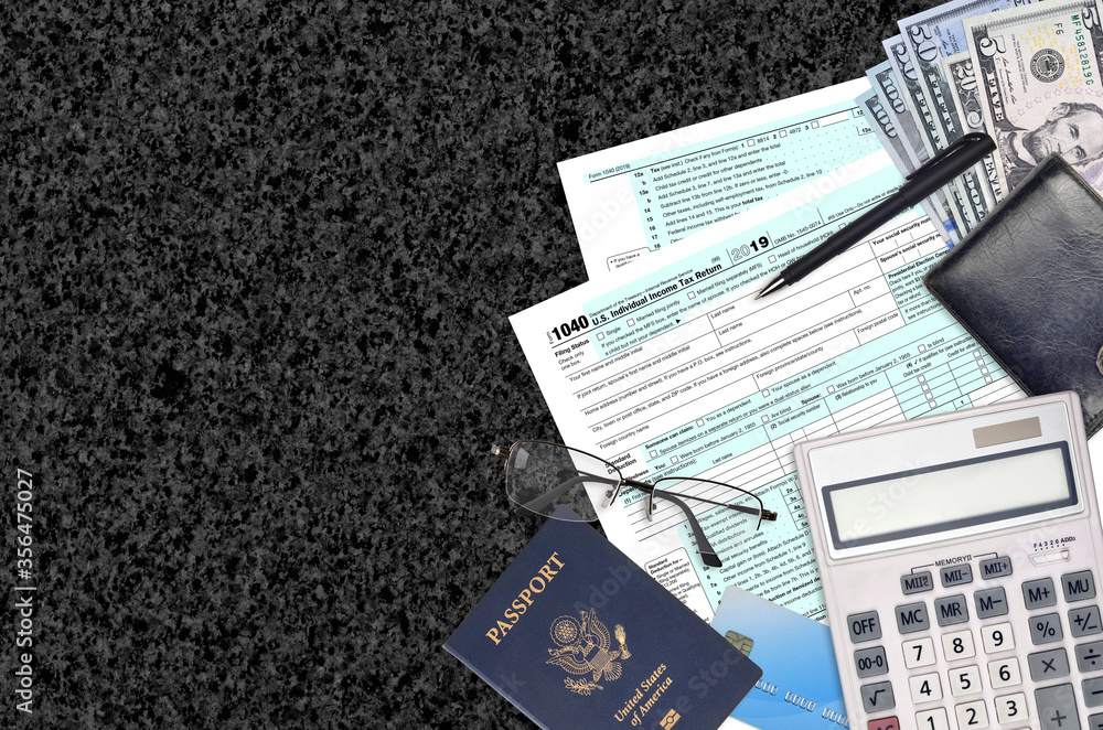 IRS form 1040 Individual income tax return lies on flat lay office ...