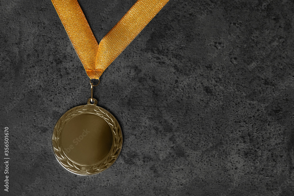 Gold medal on grey stone background, top view. Space for design Stock ...
