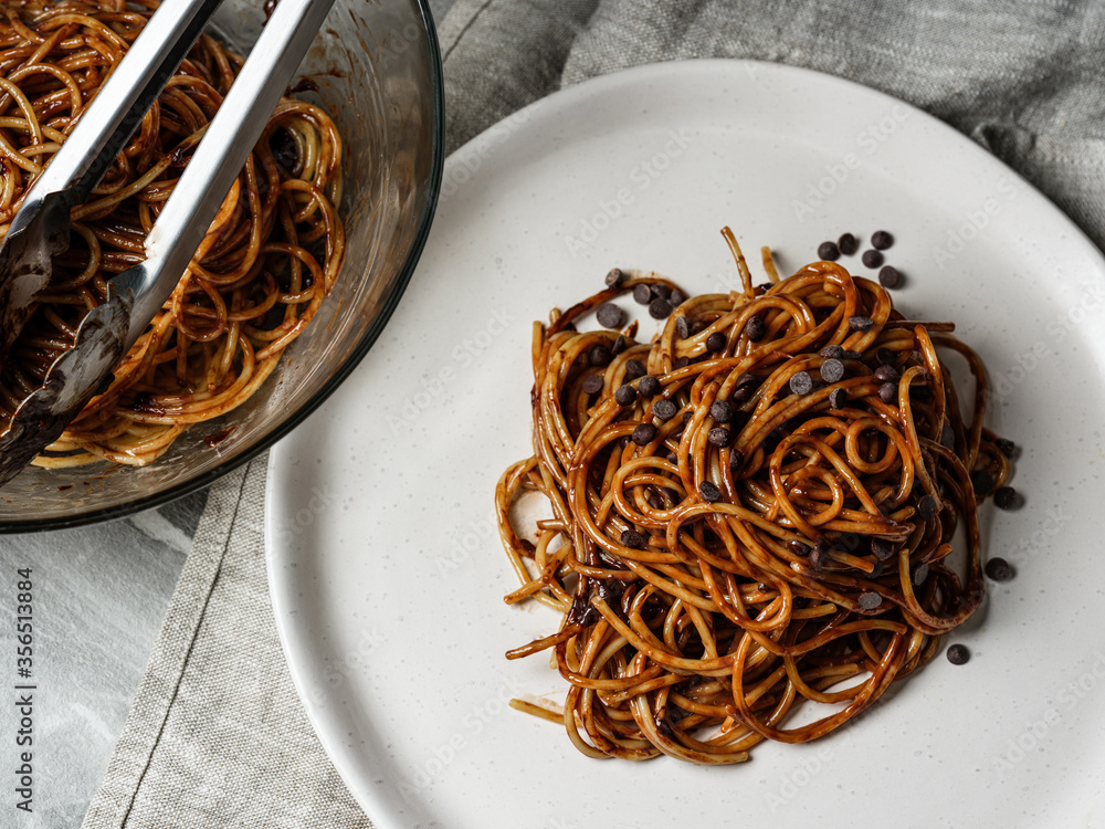 Top view pasta spaghetti with chocolate sauce for kids and vegetarian ...