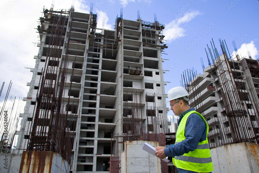 Architect on a building Construction Site Stock Photo | Adobe Stock