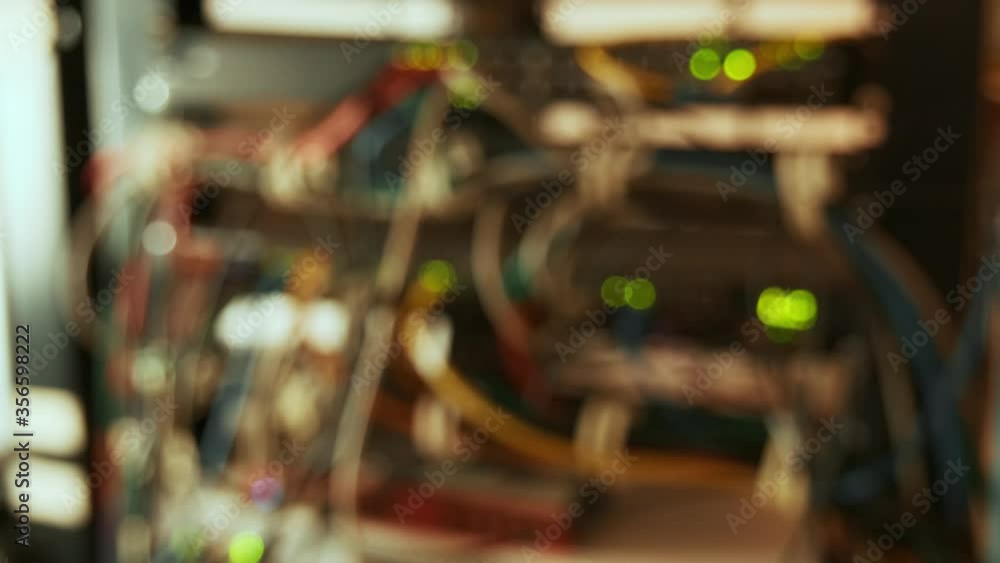 Blurred background. Network switch and ethernet cable in rack cabinet ...