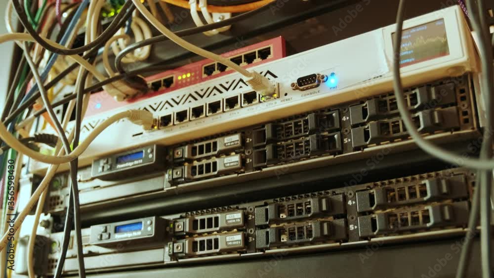 Network switch and ethernet cable in rack cabinet. Network connection ...