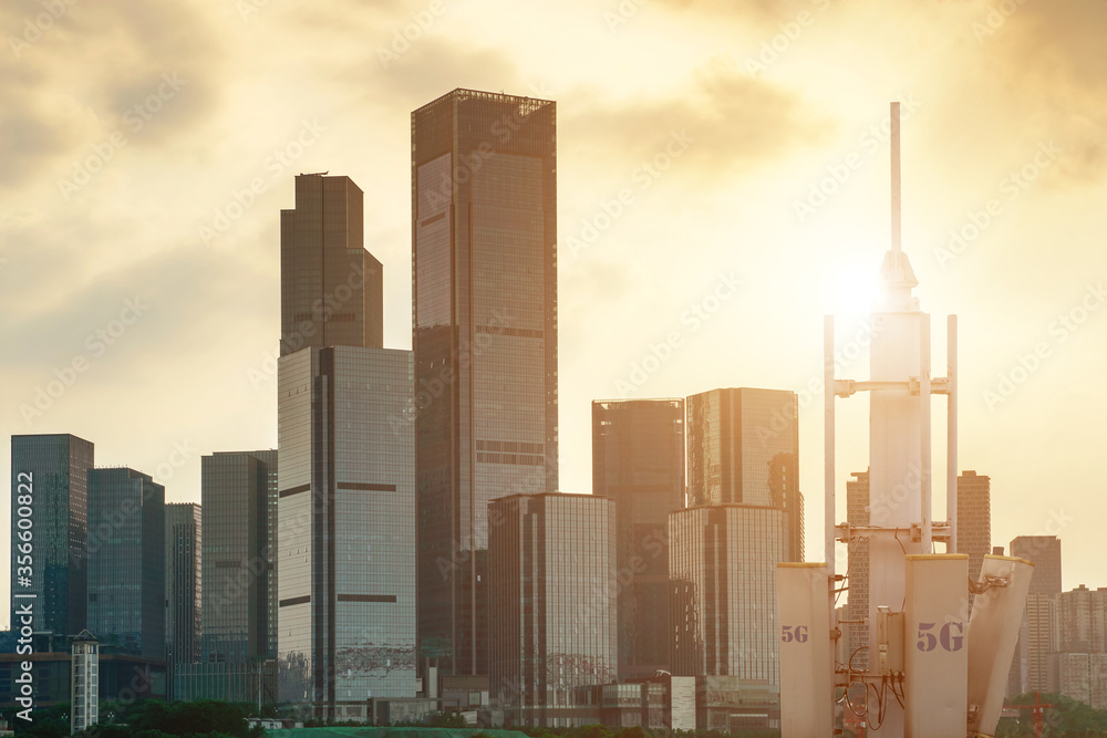 5g transmission tower and residential building with modern business ...