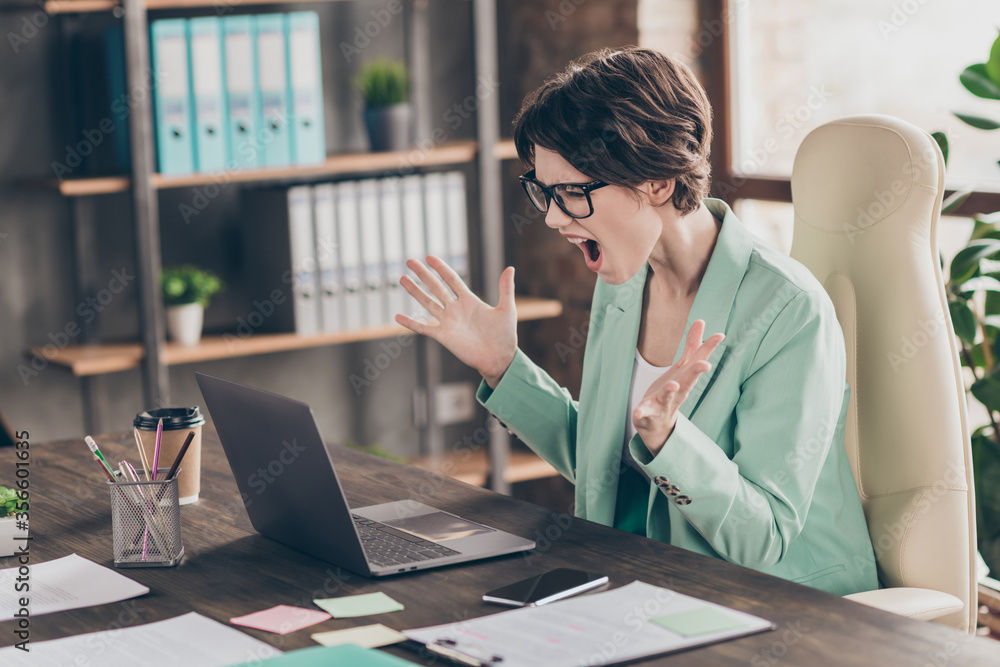 Angry frustrated depressed secretary girl agent marketer sit desk chair ...