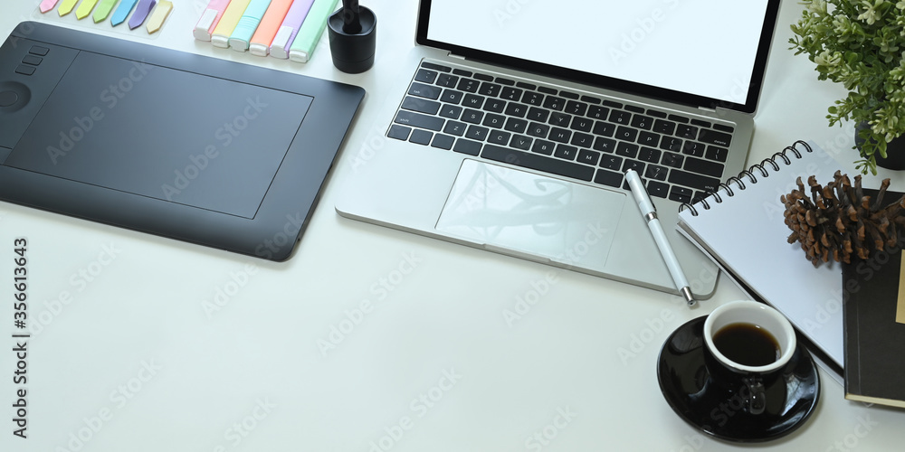 The top view image of the white working desk is surrounding by a ...