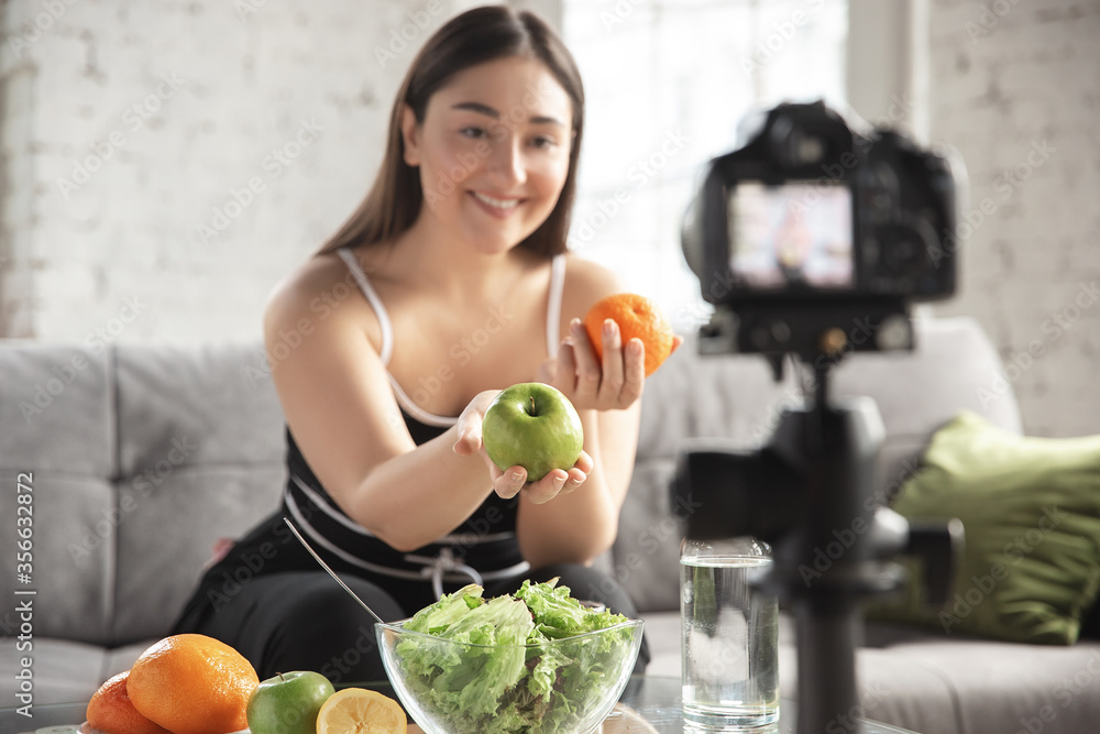 Smiling. Caucasian blogger, woman make vlog how to diet and lost weight ...