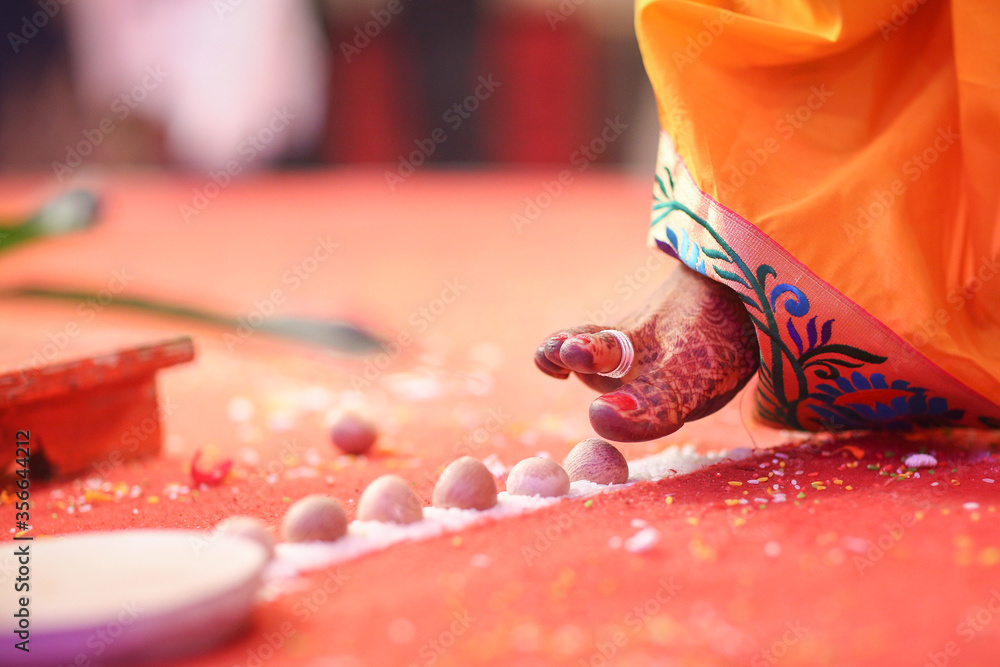 Indian traditional wedding bride take 7 steps and touching to the betel ...