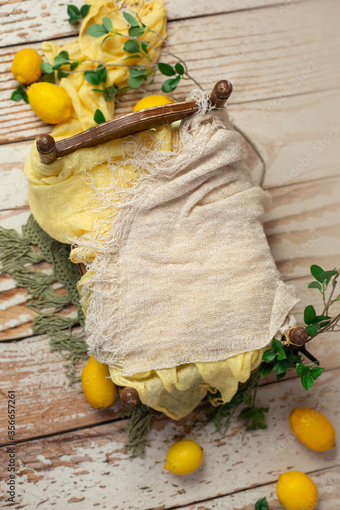 the wooden bed is decorated with lemons. props for newborn photo ...