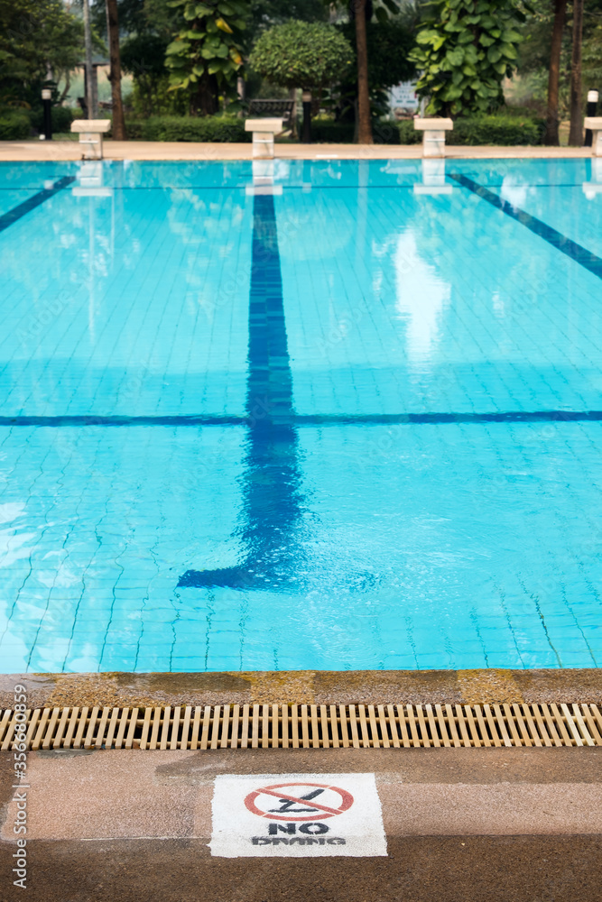 warning symbol for beware in swimming pool. Stock Photo | Adobe Stock