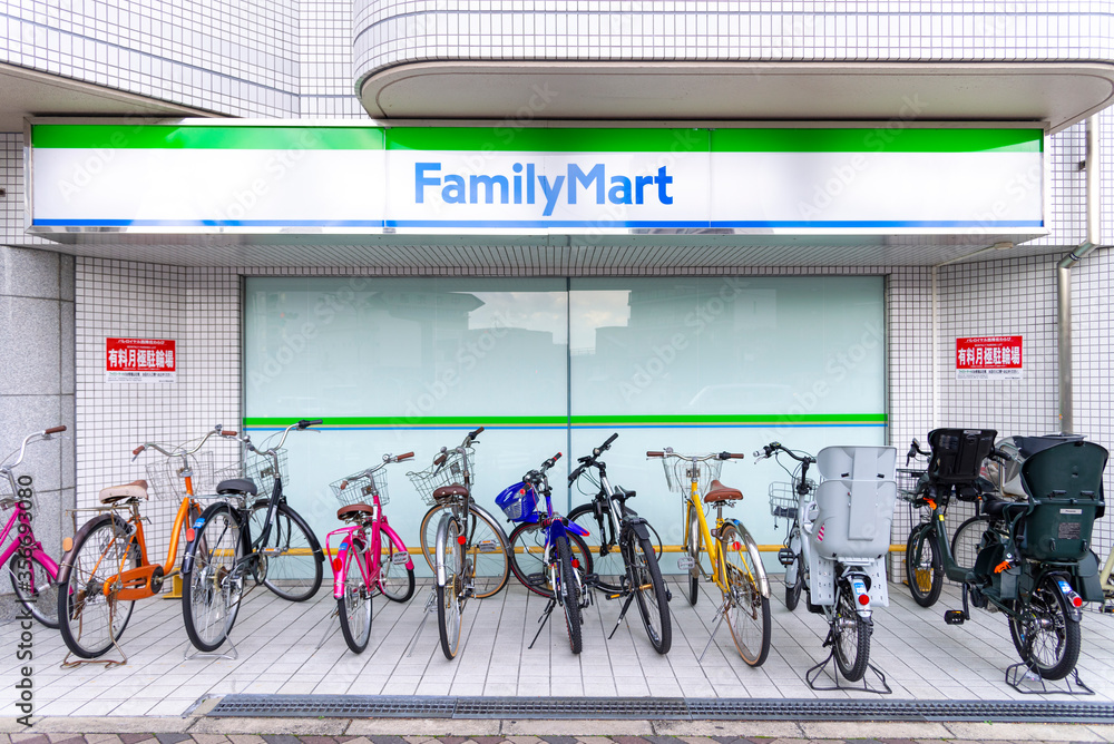 FamilyMart convenience store signage and bicycle parking. Family Mart ...