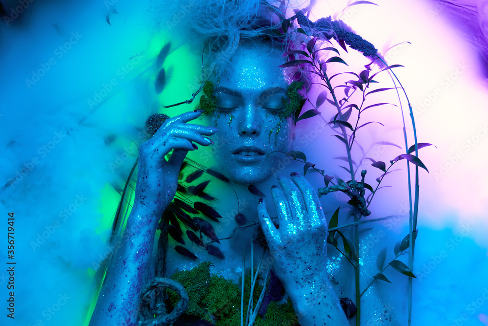 beautiful in a fantasy image Body art model lies in a d cor fog Stock ...