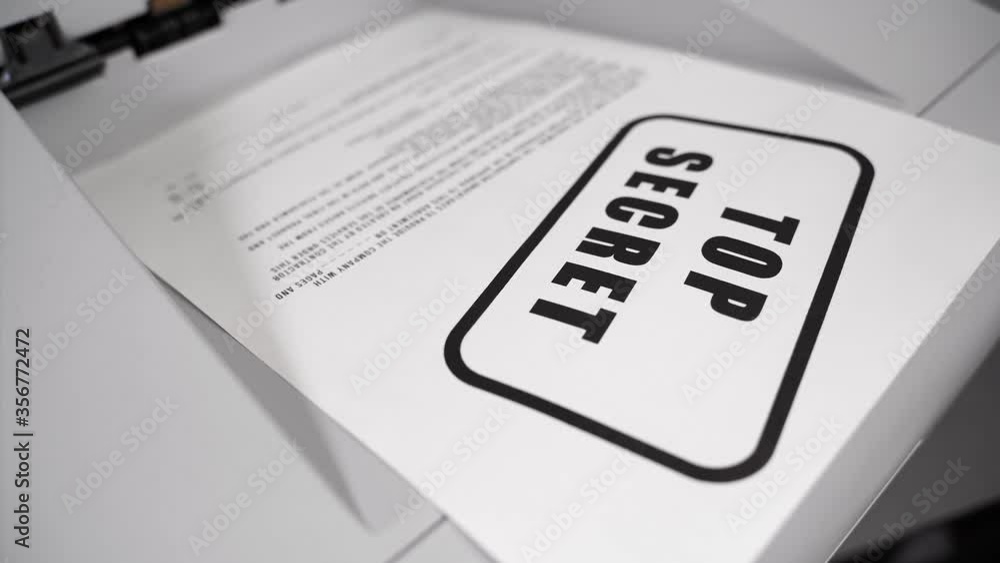 Top Secret Documents. Top secret phrase printed on an paper on office ...