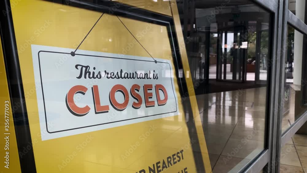 This restaurant is closed, sign in shop window in empty shopping centre ...