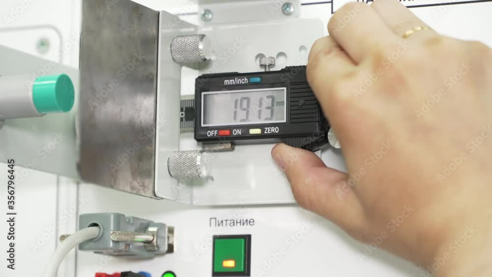 Electronic digital caliper on white dashboard. Scene. Industrial ...