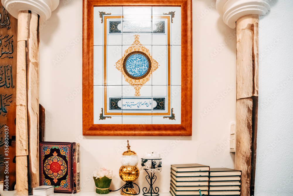 Muslim religious symbols and Koranic books. Stock Photo | Adobe Stock
