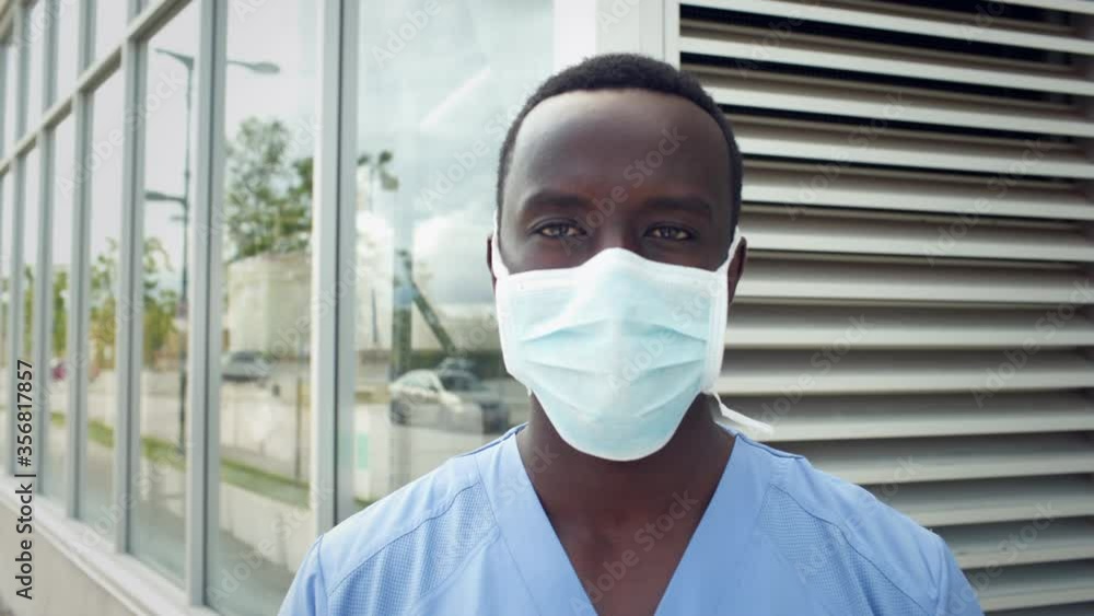 African American black man nurse doctor wearing blue PPE mask and ...