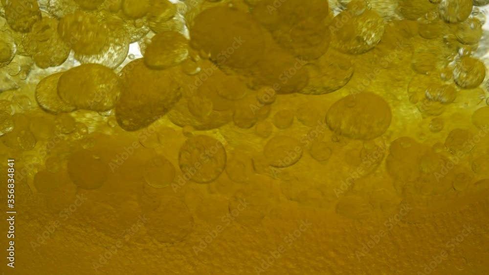 Bubble structure of air of sunflower oil on a white moving background ...