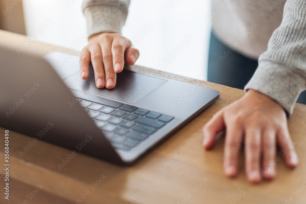 Closeup image of a businessman working and using laptop computer on a ...
