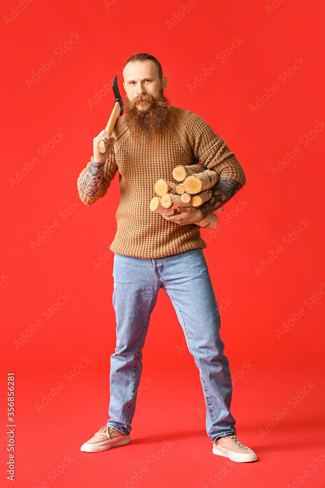 Handsome lumberjack on color background Stock Photo | Adobe Stock