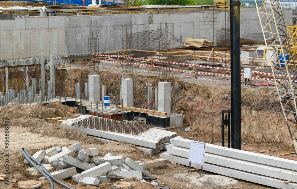 Mounting of foundation and basement of building. Concrete blocks, metal ...