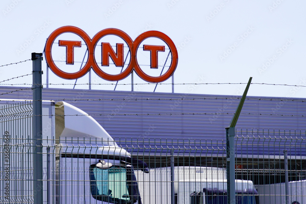 TNT logo sign on industrial building for international truck mail ...