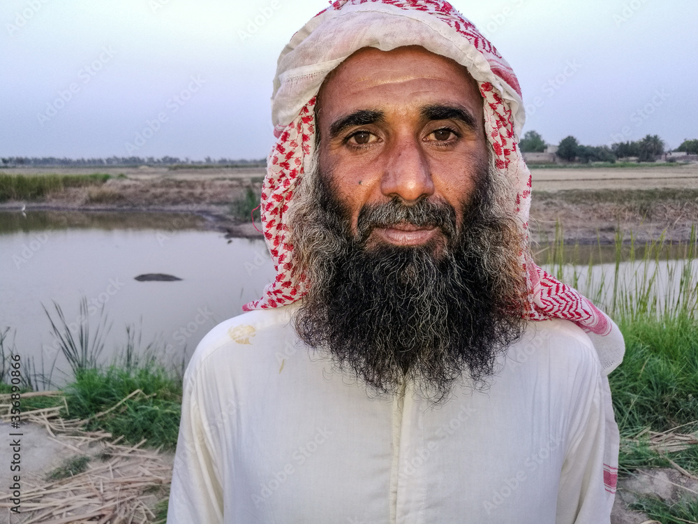 Poster a homeless an old man wearing arabic traditional clothes and ...
