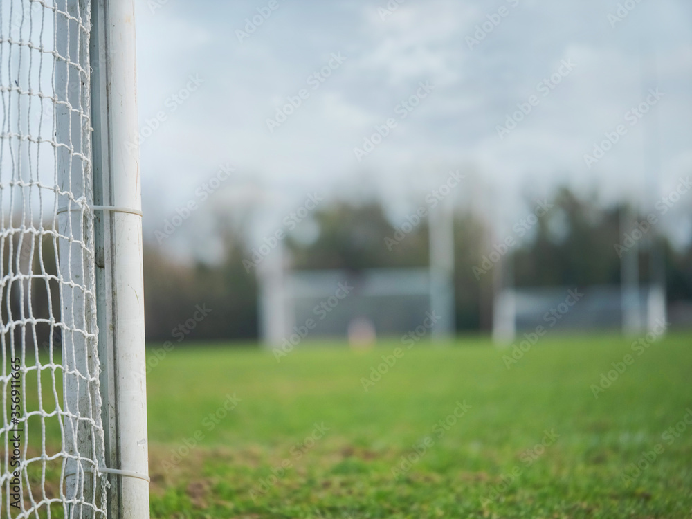 Side of goal post in focus, Two goal posts for Irish National sport ...