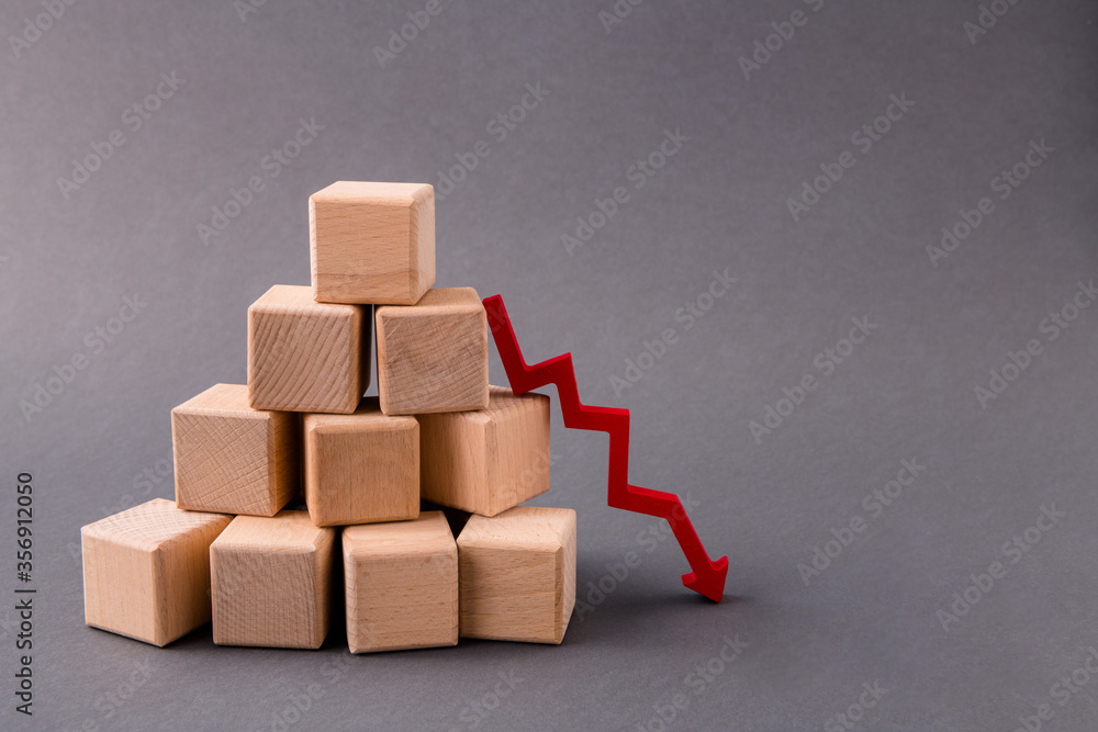 Photo of pile stack pyramid wooden cubes market supply sales falling ...