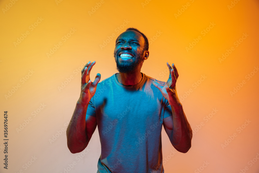 Angry screaming. African-american man's modern portrait on gradient ...