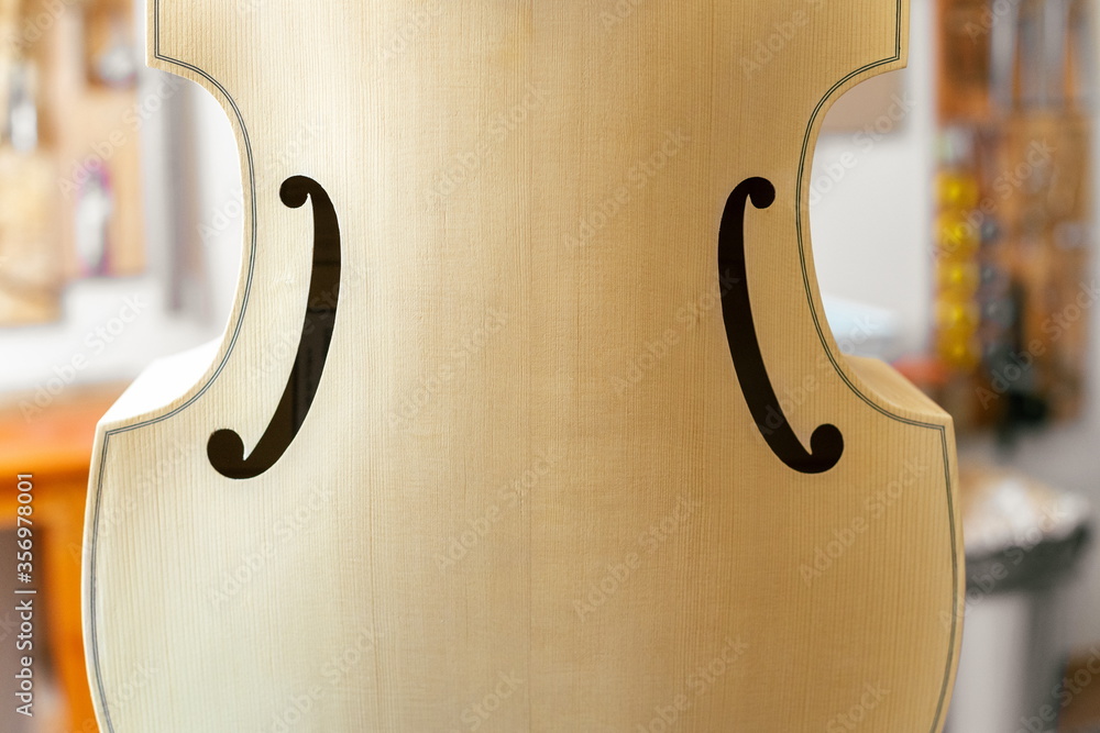 Cello in one of the stages of its construction in the Luthier's ...