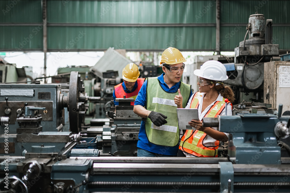 Teamwork professional engineering wearing uniform safety and helmet ...