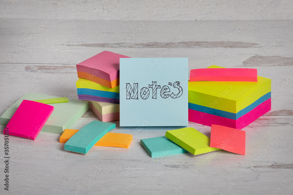 Colorful posted notes with the word notes written on it stacks and ...
