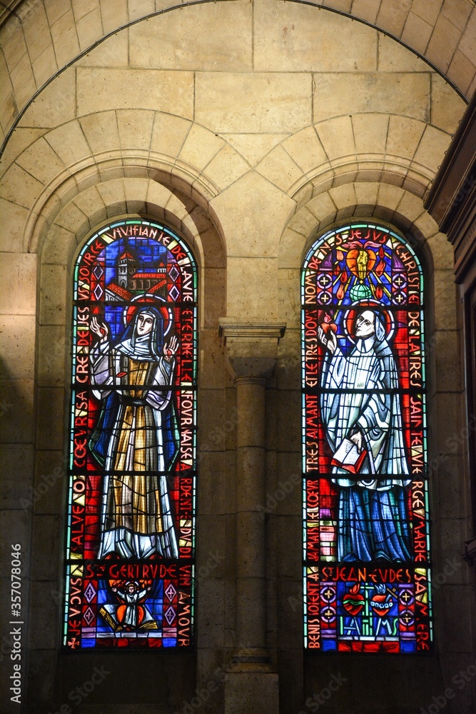 Religious paintings on the windows of a church Stock Photo | Adobe Stock