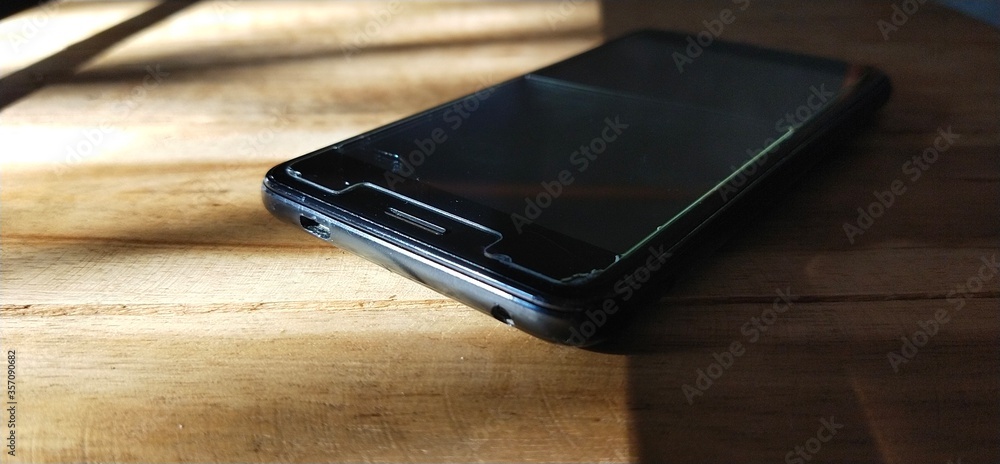 Old phones have broken marks, unusable on the wooden surface with ...