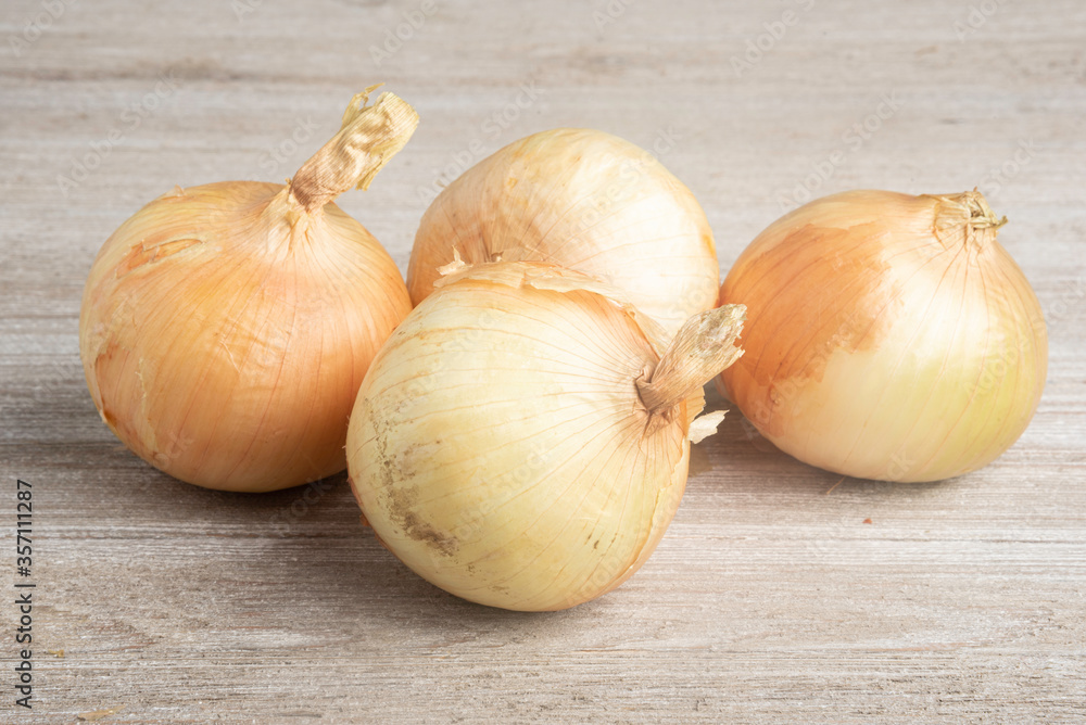 Four Sweet White Onions On A White Painted Panel Board Stock Photo ...