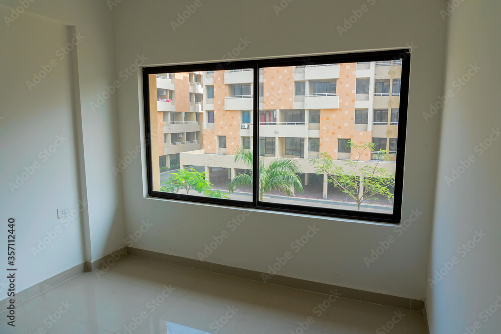 Inside view of window and room of new residential flats being built at ...