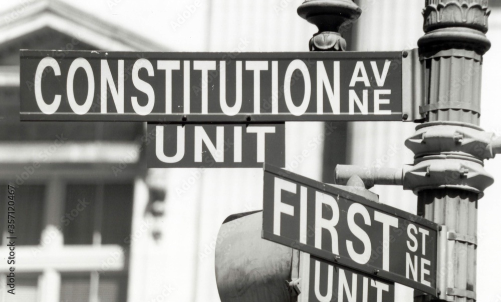 Road signs at the intersection of Constitution Ave. and First St. in ...