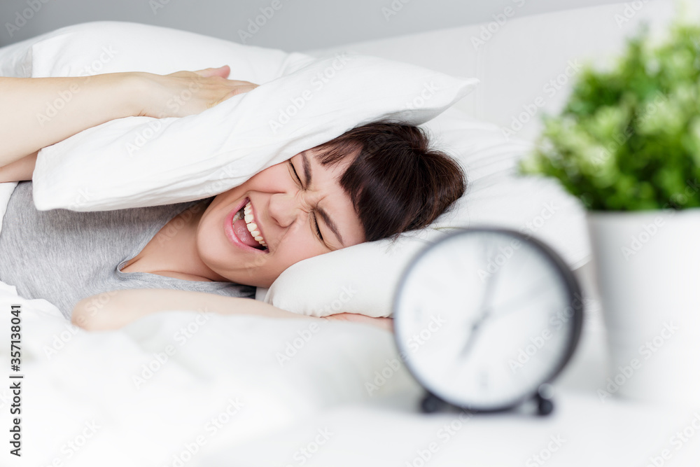 insomnia and routine concept - woman waking up with alarm clock, crying ...
