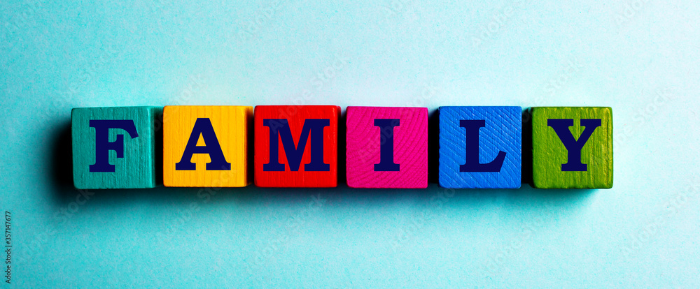 The word FAMILY is made up of multi-colored cubes on a blue background ...
