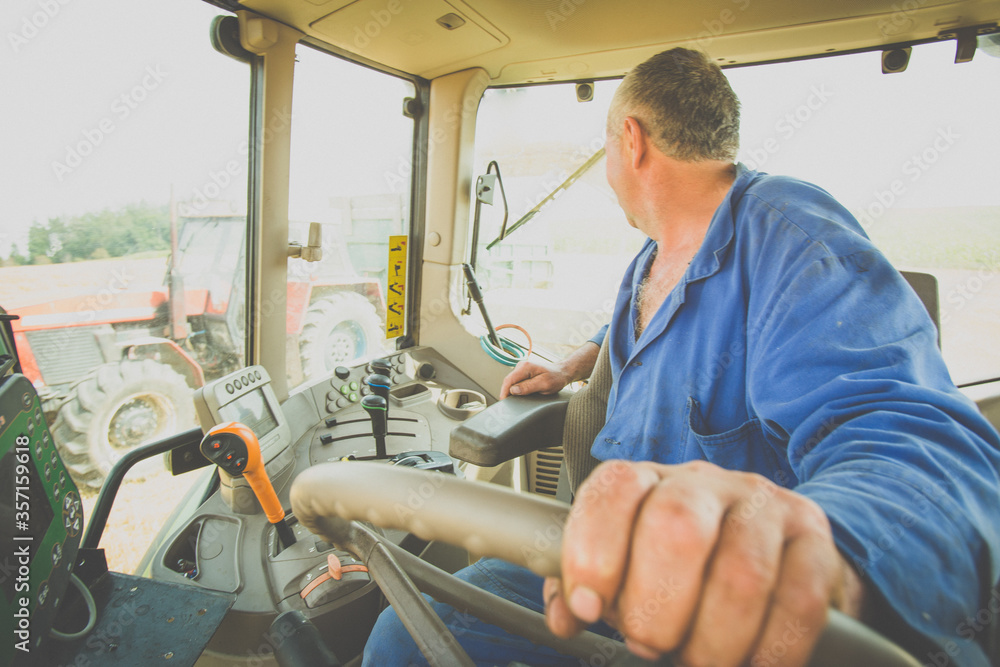 Tractor working on the farm, modern agricultural transport, farmer ...