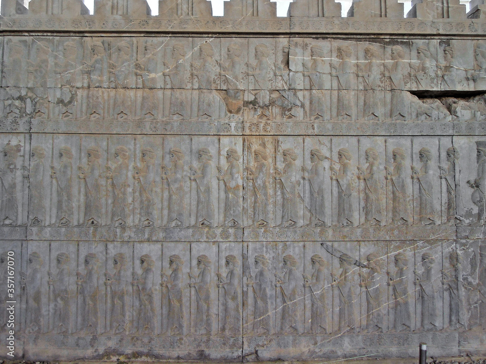 Bas-reliefs of marching Midian and Persian warriors decorating walls of ...