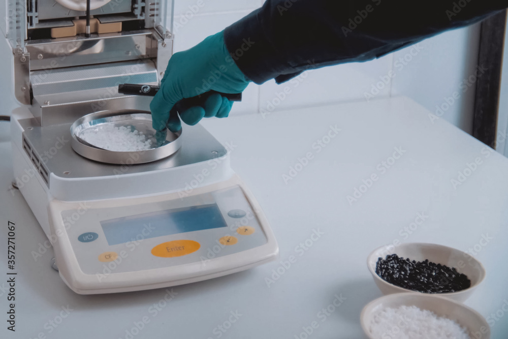 Weighing the components of explosive on electronic scales. Stock Photo ...