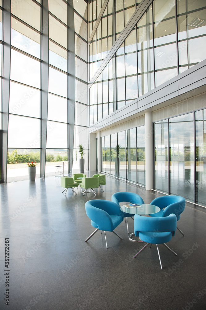 Chairs and table in office lobby area Stock Photo | Adobe Stock
