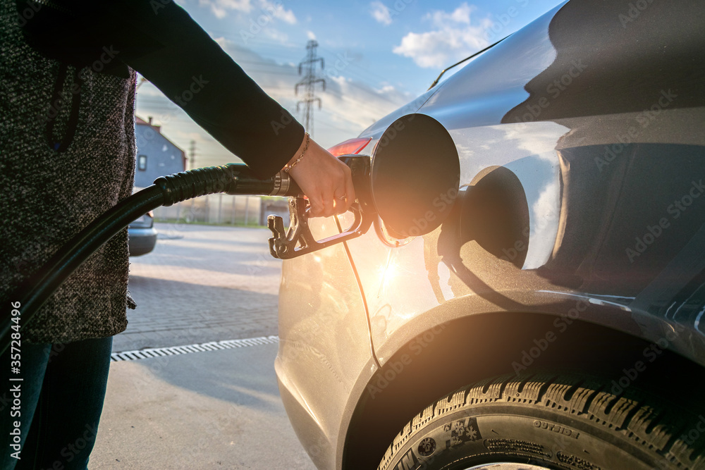 Gas station. Pump fuel petrol in tank car. Gasoline oil in nozzle ...