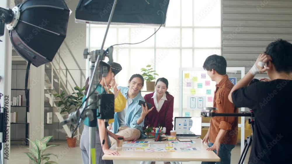 Behind the scenes of video production crew team shooting group of Asia ...