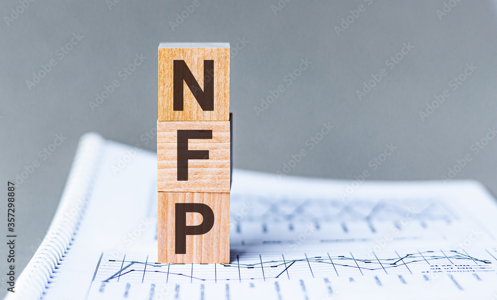 Word NFP - Non Farm Payrolls - acronym concept on cubes and diagrams on ...